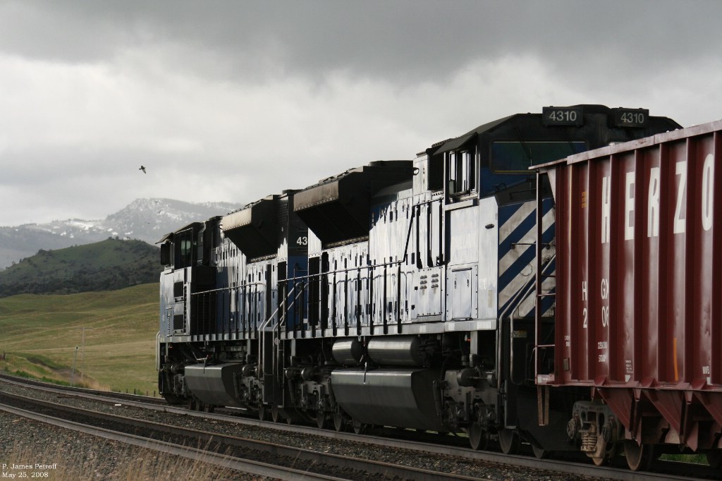 MRL 4310 (SD70ACe) heads into the low hanging clouds above the Gallatin Range